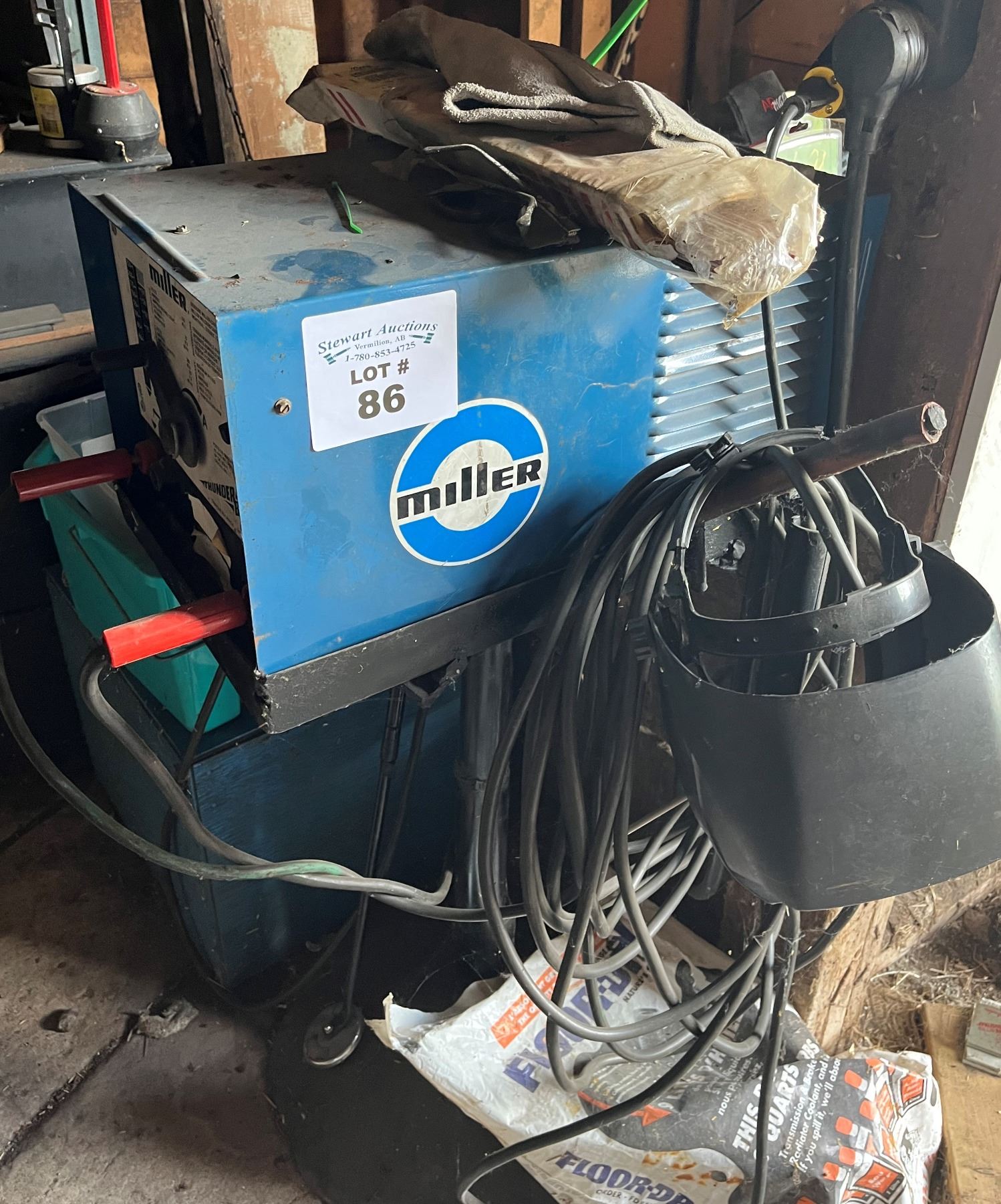 Miller welder c/w helmet & pail of rods