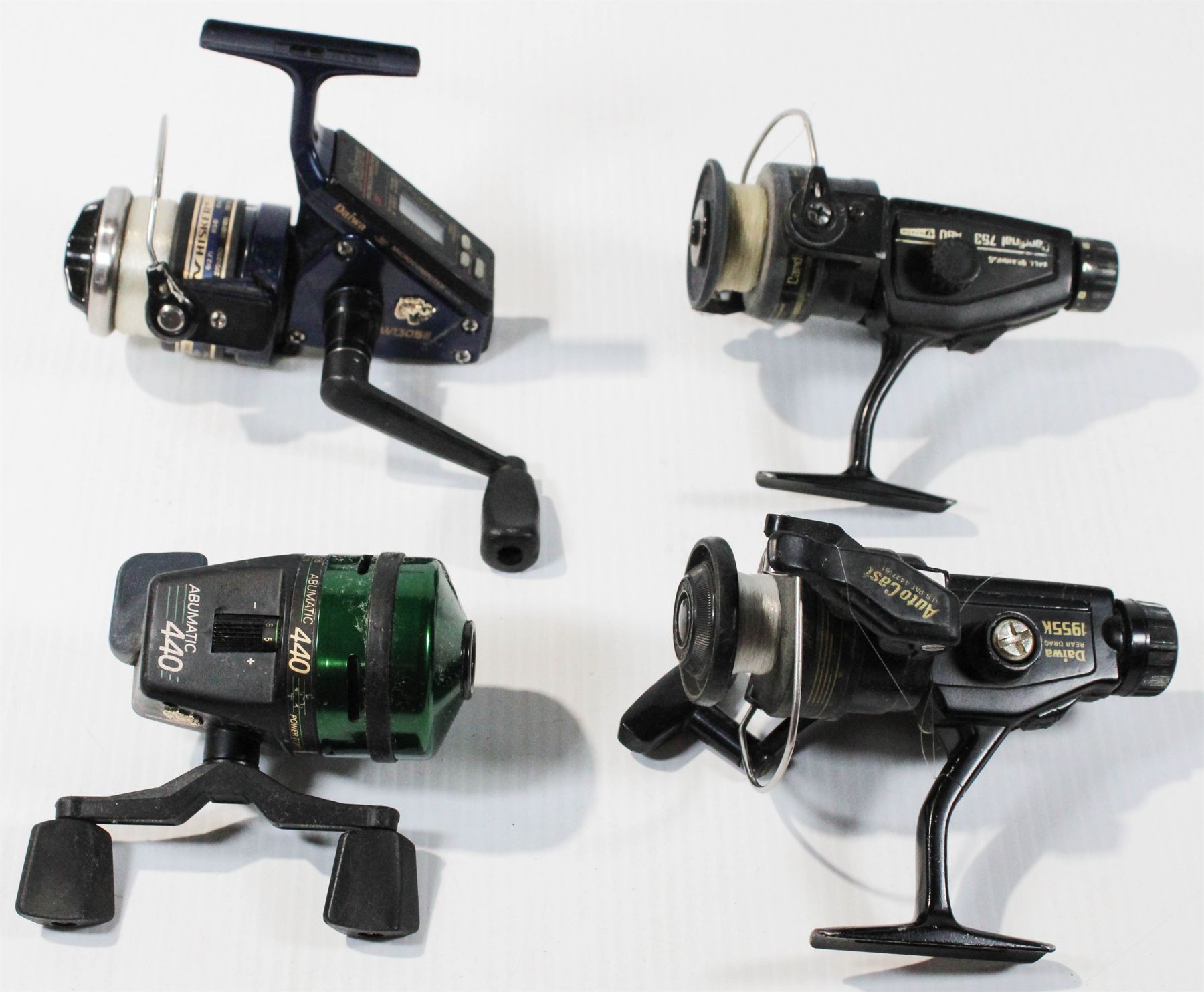 FOUR FISHING REELS