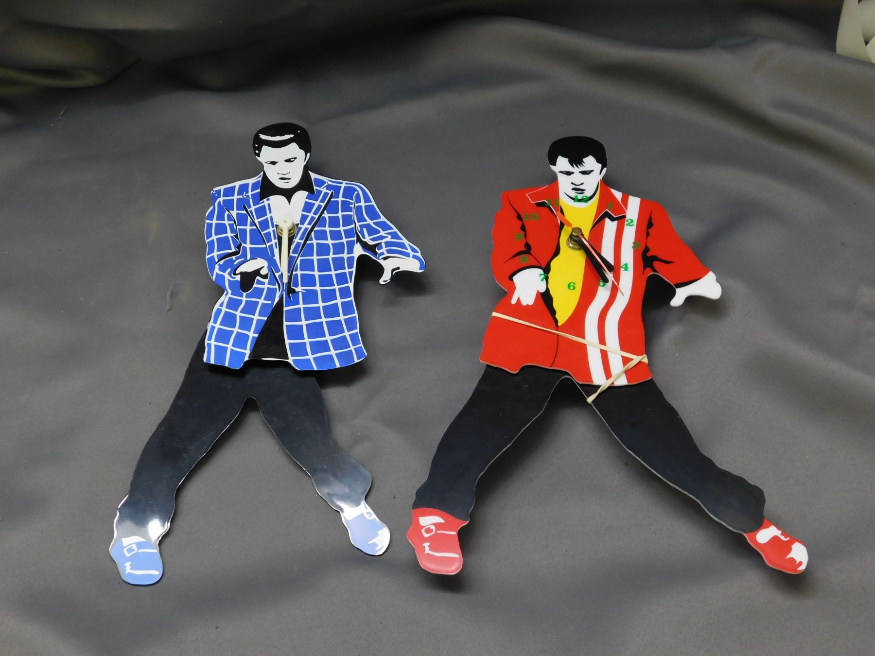 Pair of Elvis Hip Swinging Cutout Wall Clocks