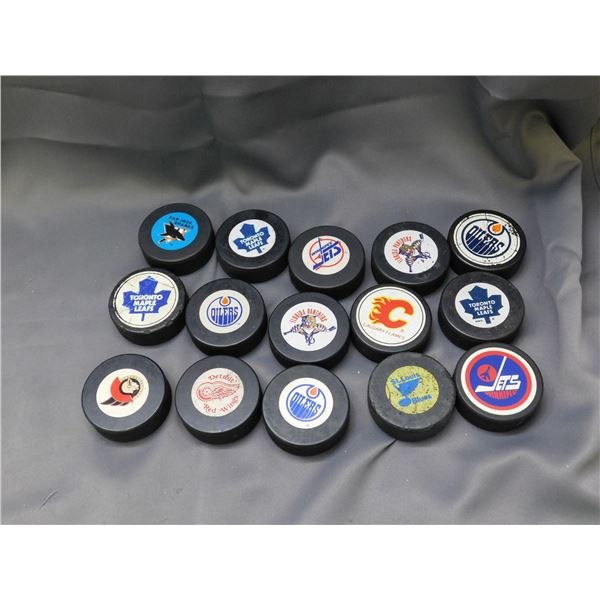 Lot of 15 Hockey Pucks NHL Jets, Oilers, Maple Leafs, Etc