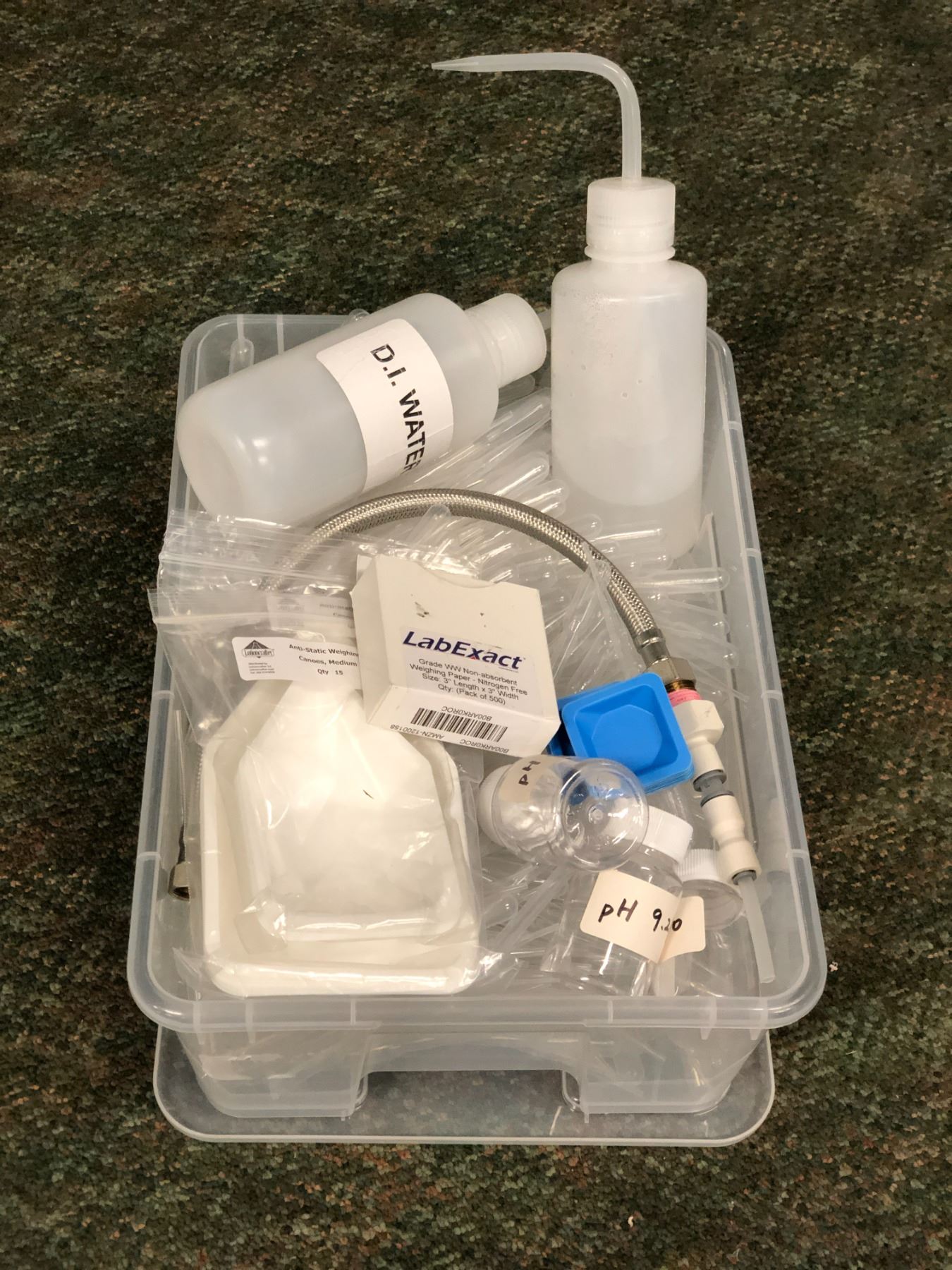 Box full of assorted lab items - includes assorted weighing canoes ...