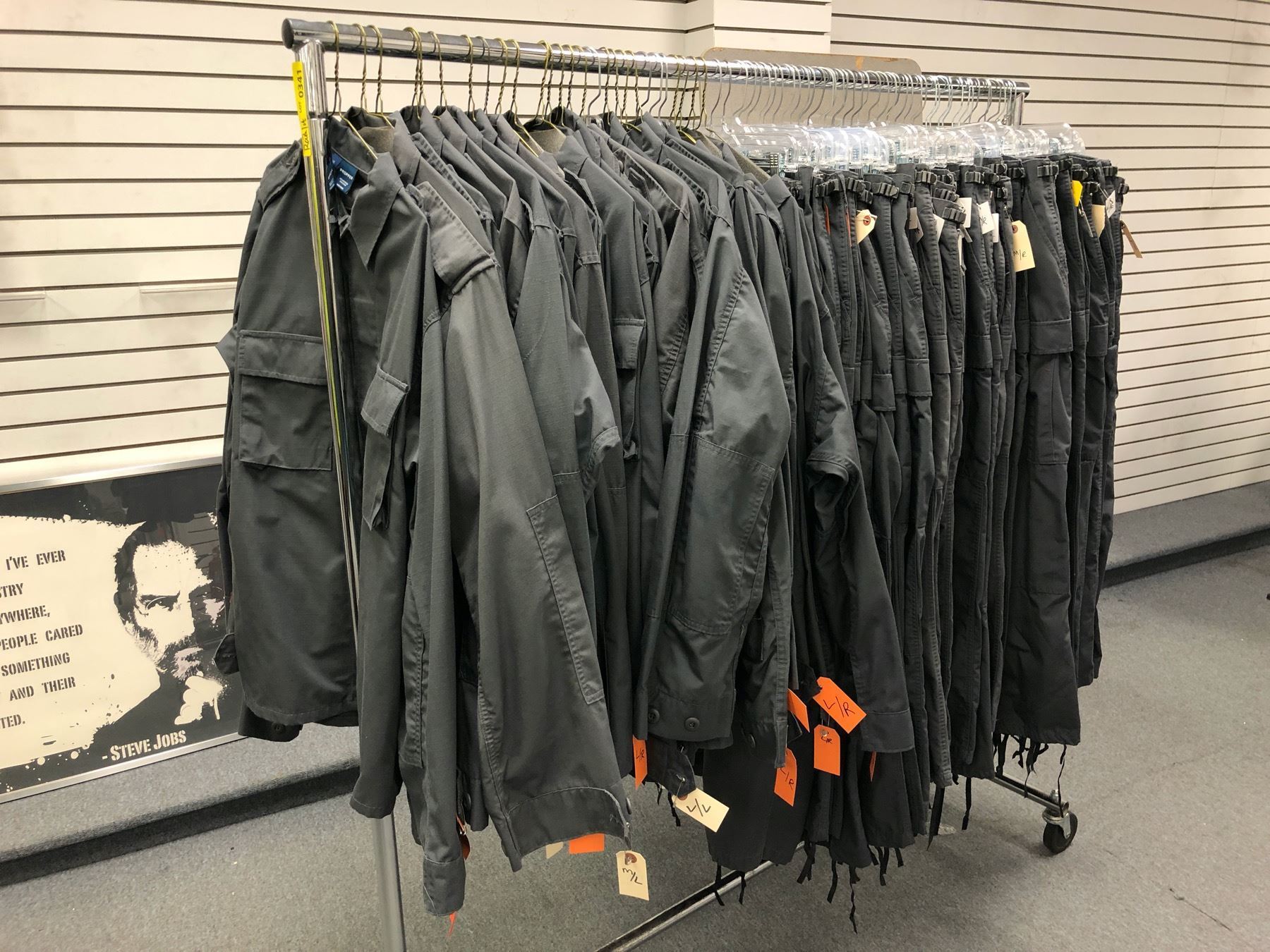 Rack full of military gray uniform shirts & trouser - approx. 25 shirts ...