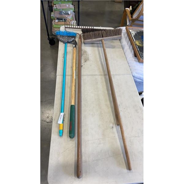 Bundle Of Brooms Weeder And Rake