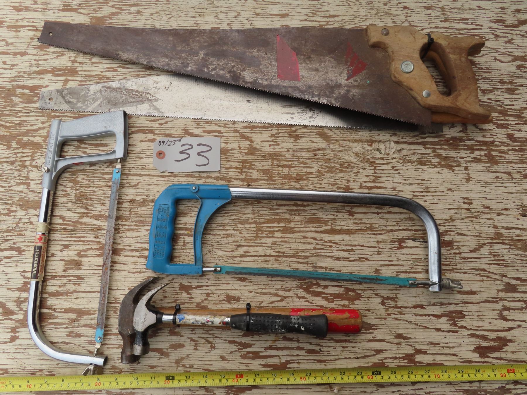 2 wood saws (26"), 2 Hacksaws, 2 hammers - Schmalz Auctions