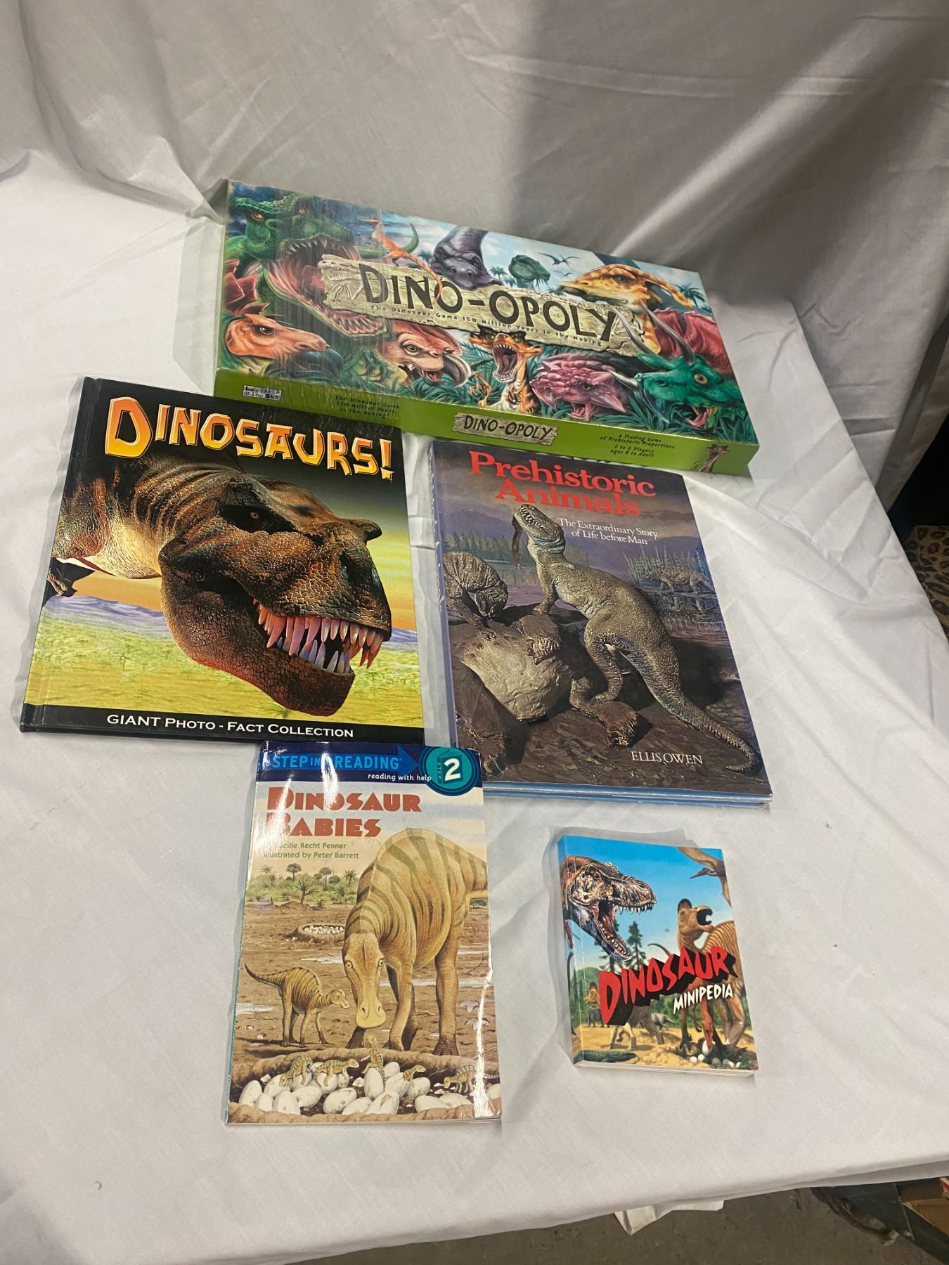 Dino-o poly game and dinosaurs books