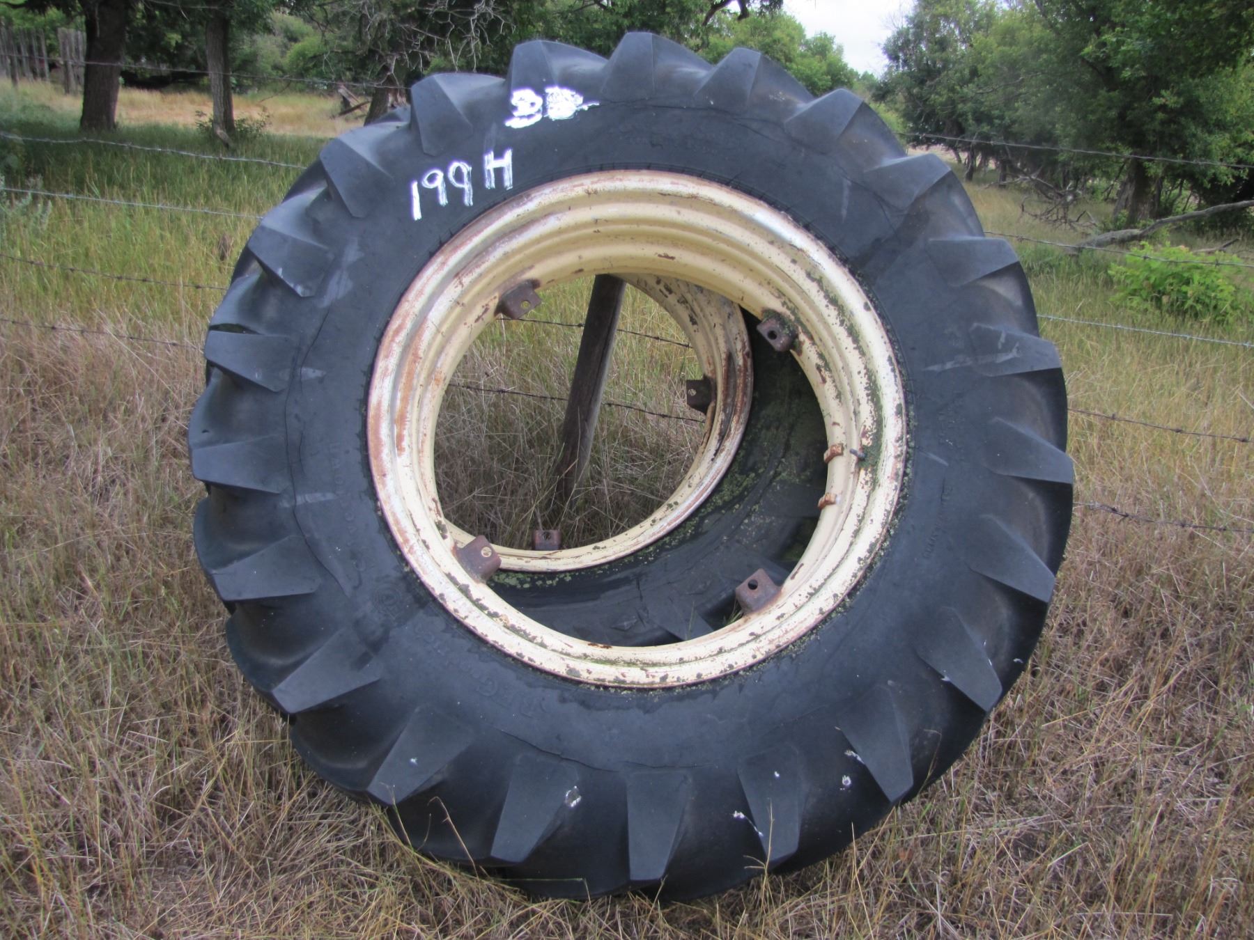 Set of tractor tires and rims 18.4 by 34 on 16 inch rim