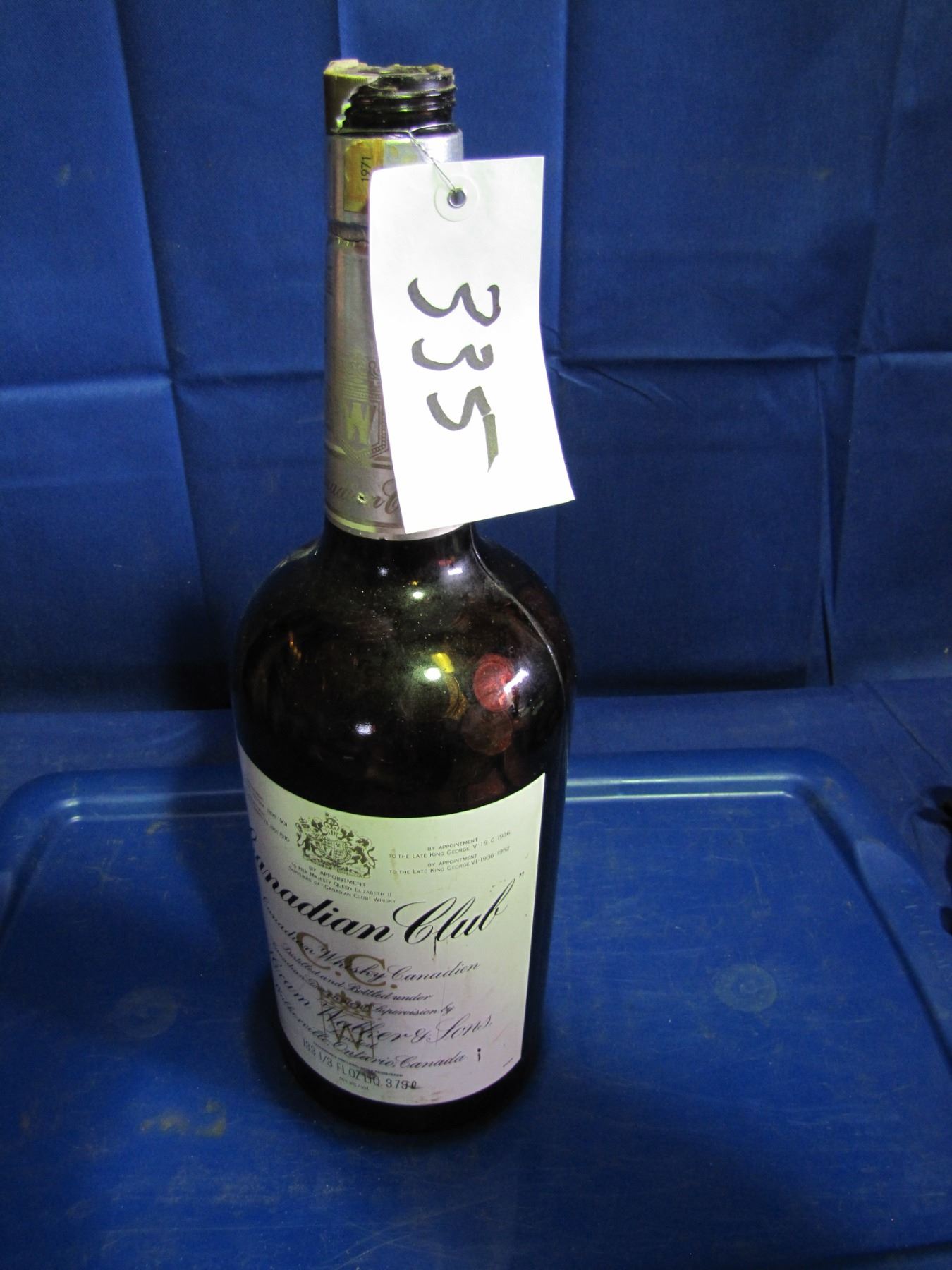 Canadian club Texas Mickey full of pennies