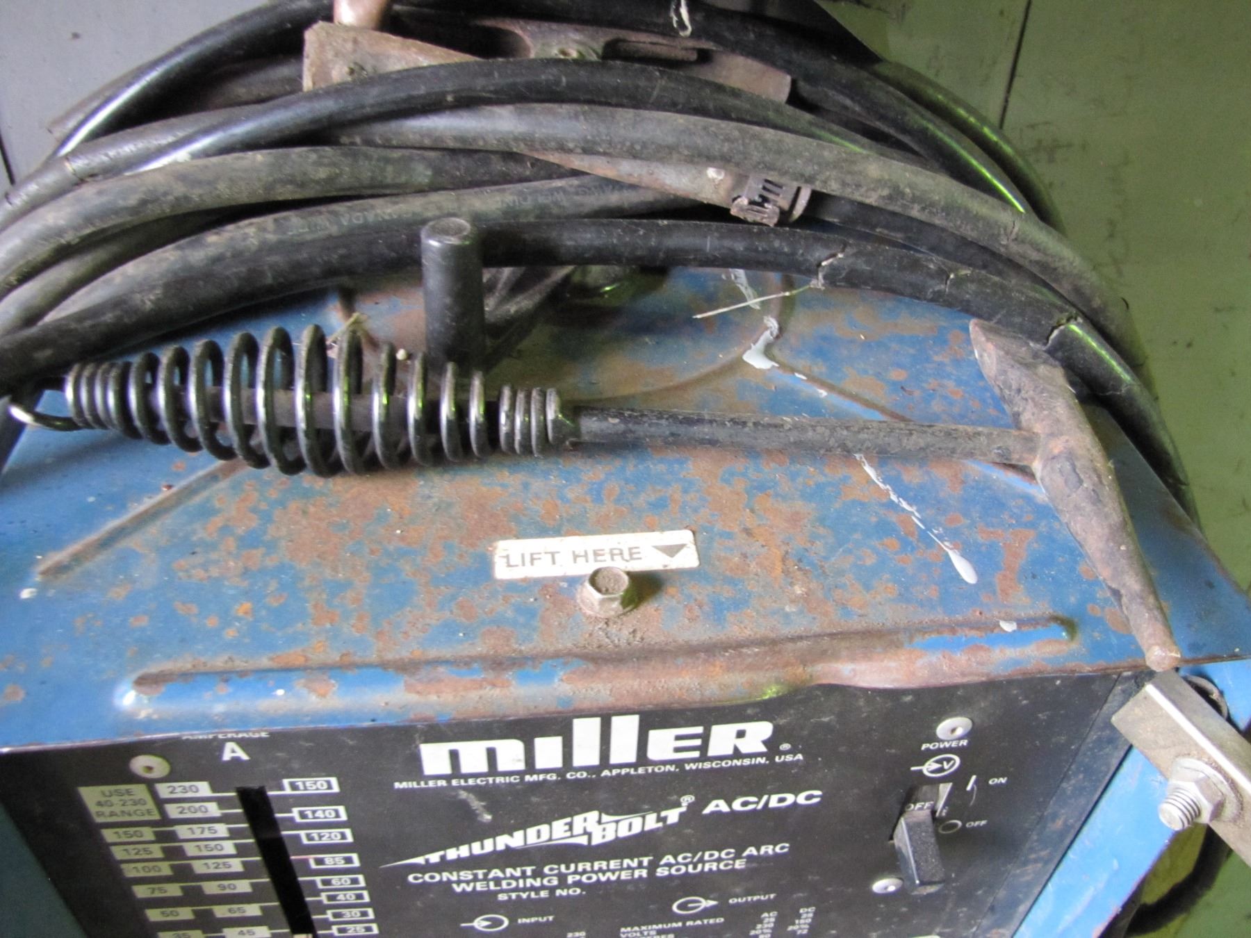 Miller Thunderbolt AC - DC arc welder with welding rods and helmet etc