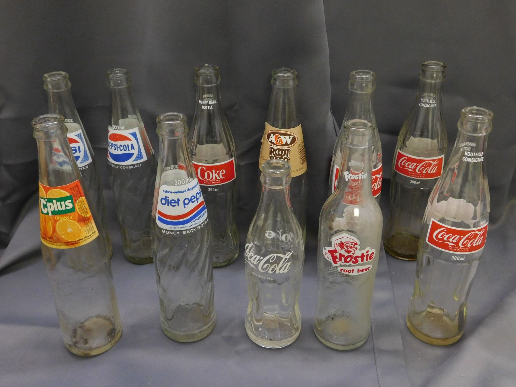 Lot of 11 Soda Pop Bottles Coca Cola Pepsi Cplus Frostie A&W