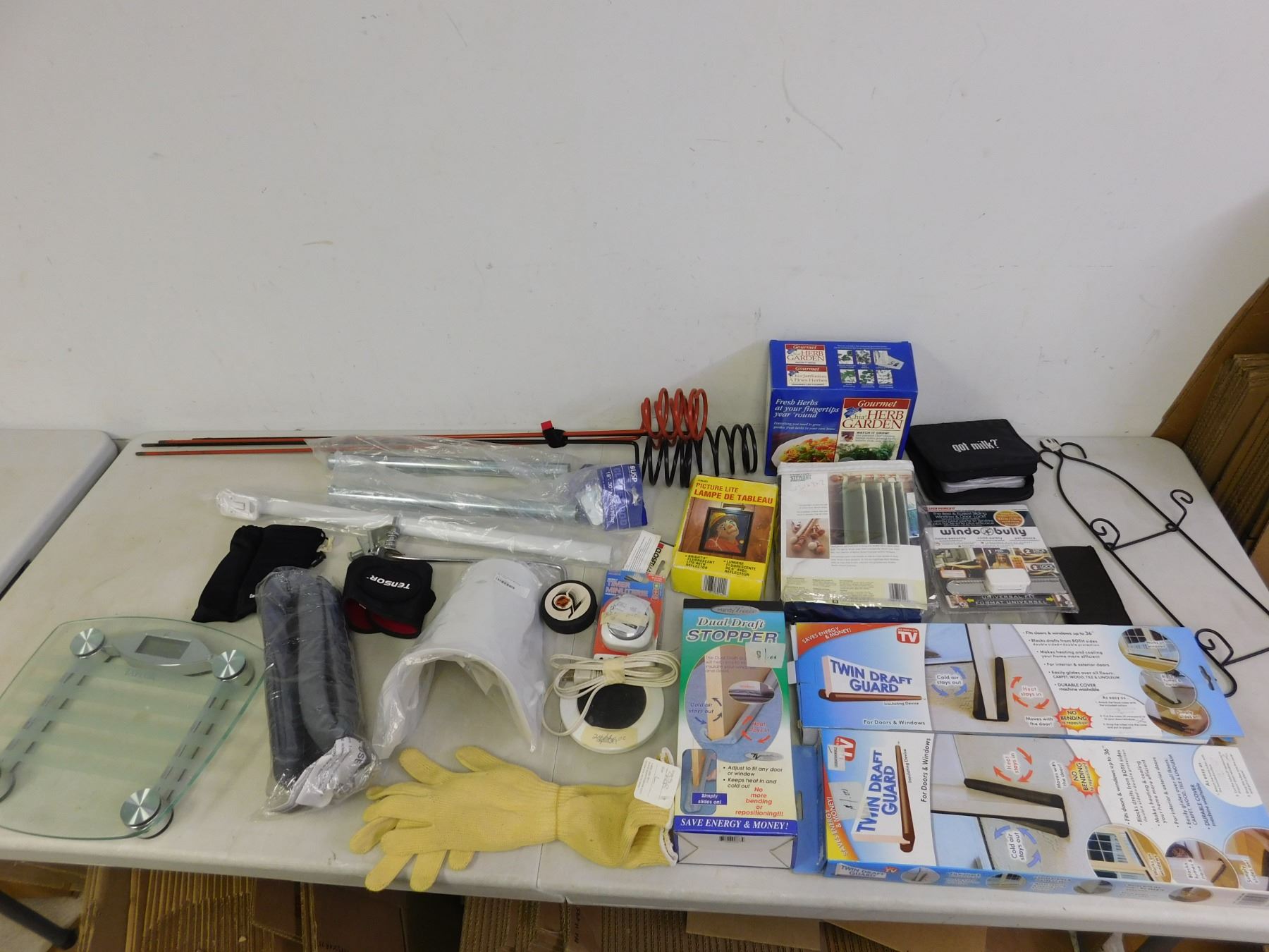 Table Full of Household Items Closet / Curtain Rods, Scale, Window ...