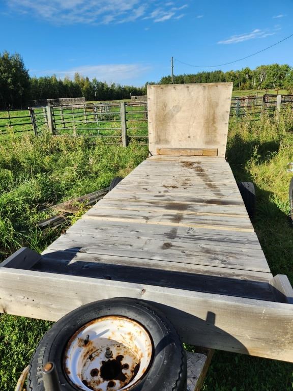 trailer with wooden deck fold down ramp
