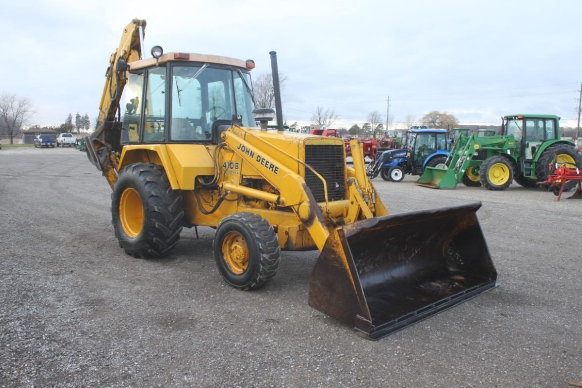 JD 410B 4wd backhoe, cab, extendahoe, 19.5x24, 5352 hours