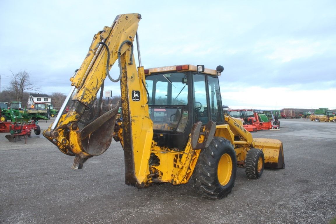 JD 410B 4wd backhoe, cab, extendahoe, 19.5x24, 5352 hours