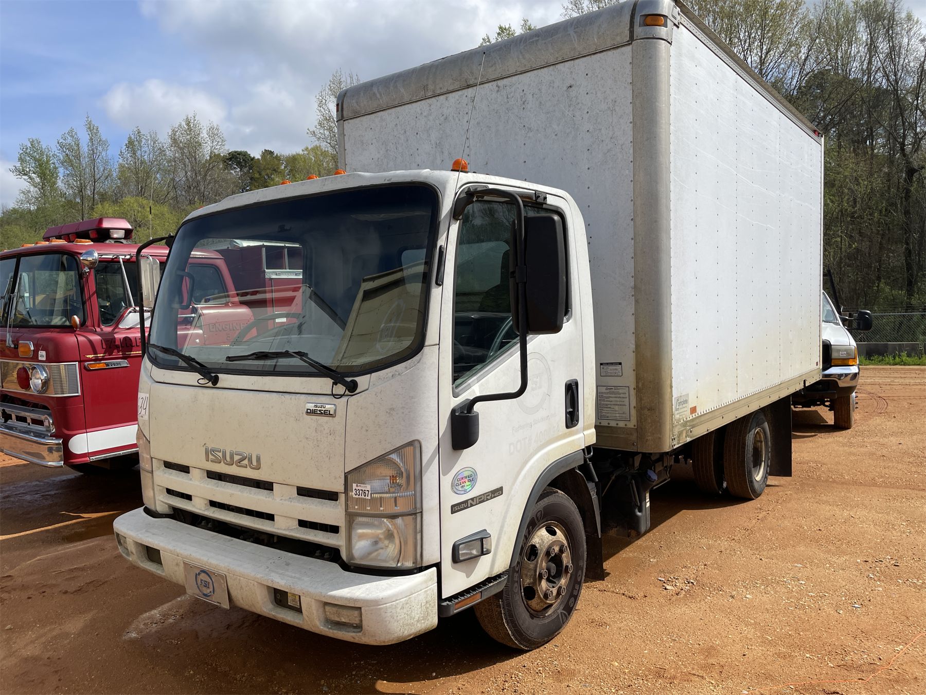 2013 ISUZU NPR HD Box Truck - J.M. Wood Auction Company, Inc.
