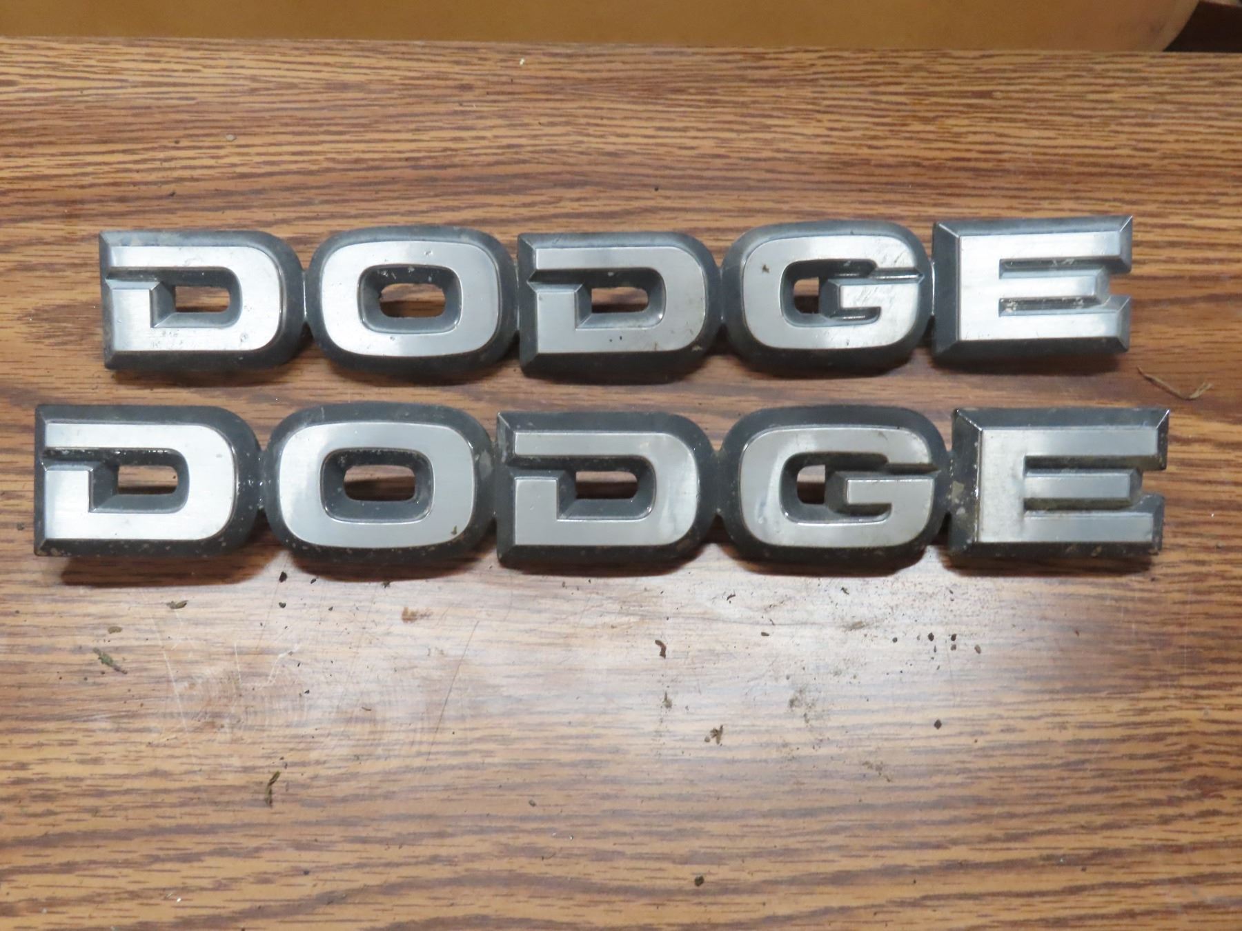 pair of dodge badges - Schmalz Auctions