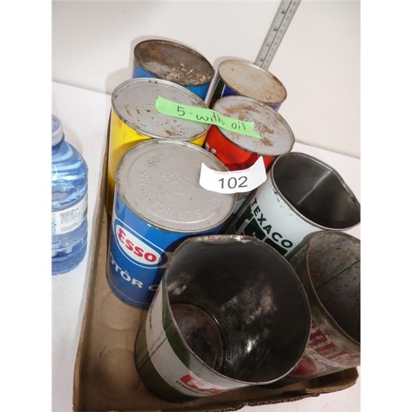 Collection of vintage oil cans 5- with oil in them