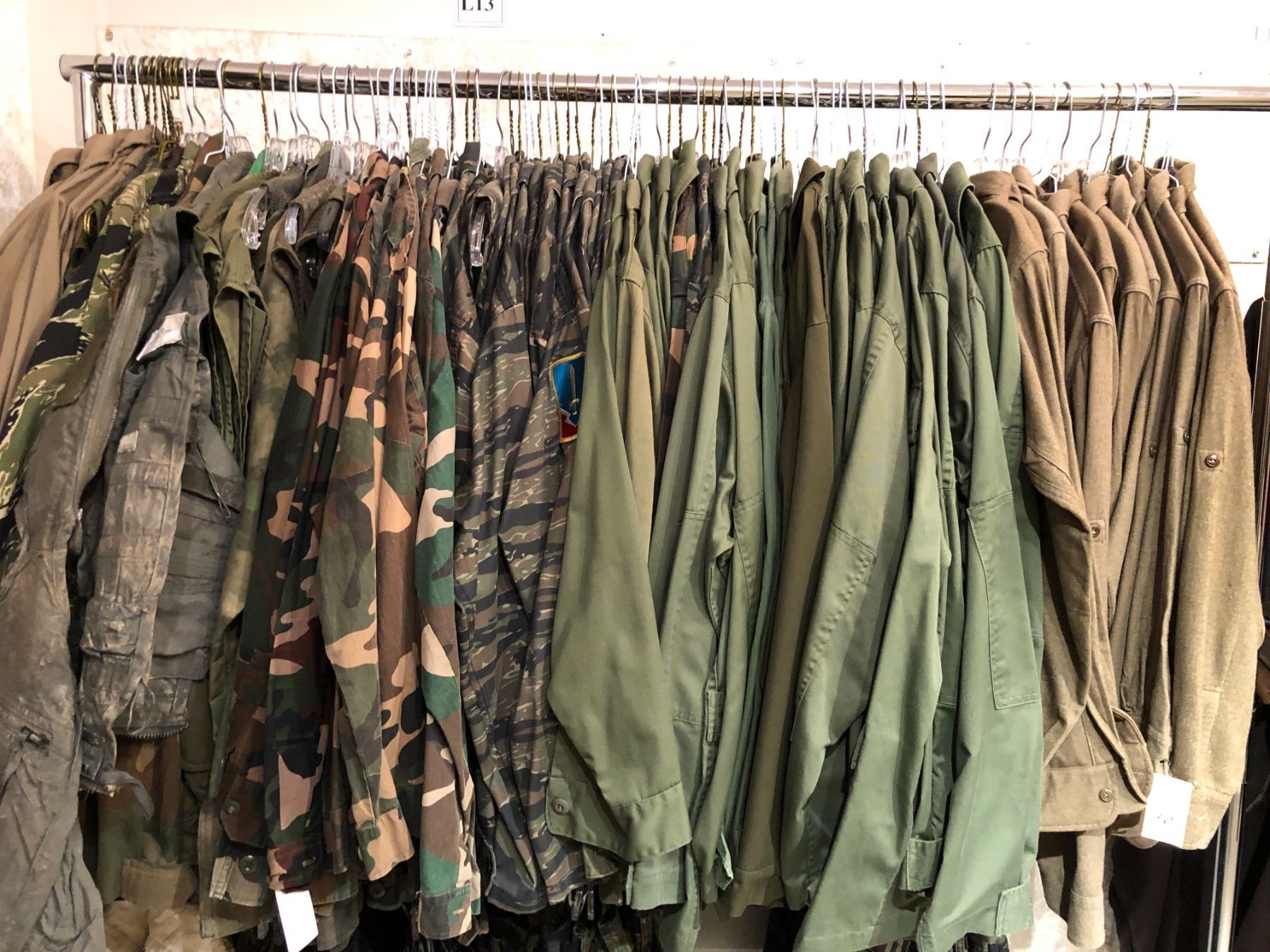 Large Group of Screen Worn Military Uniforms (Contents of 2 Racks)