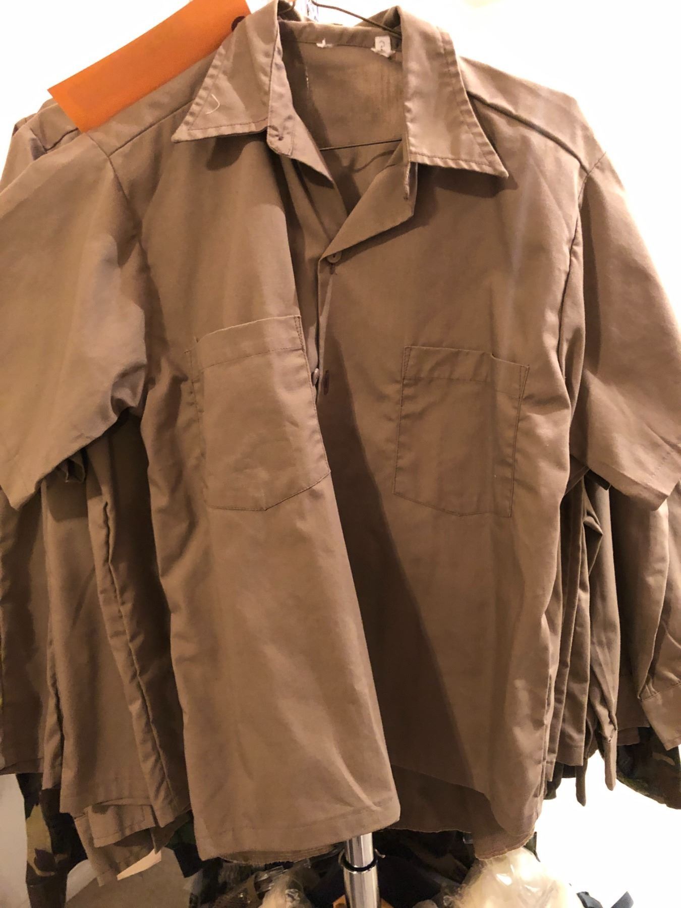 Large Group of Screen Worn Military Uniforms (Contents of 2 Racks)