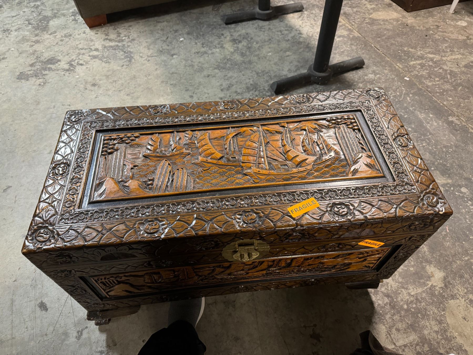 Carved trunk ship motif leg needs repair