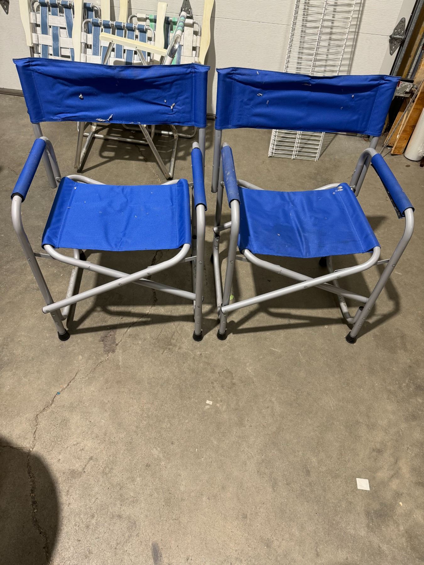 Two folding camp chairs