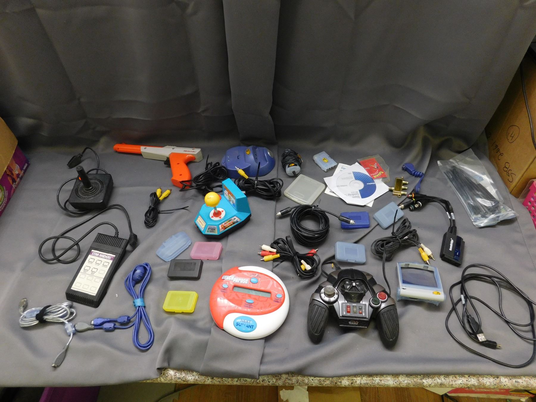 Lot of Misc Video Game TV Plug N Play, NES Light Gun, Gameboy Cases ...