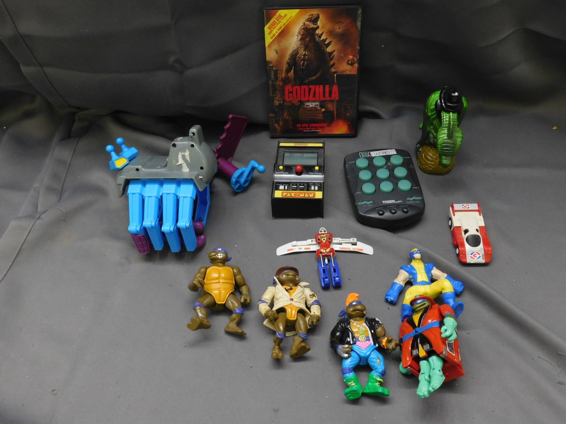 Lot of Assorted Vintage Toys Godzilla DVD, Wolverine, Pac-Man, TMNT ...