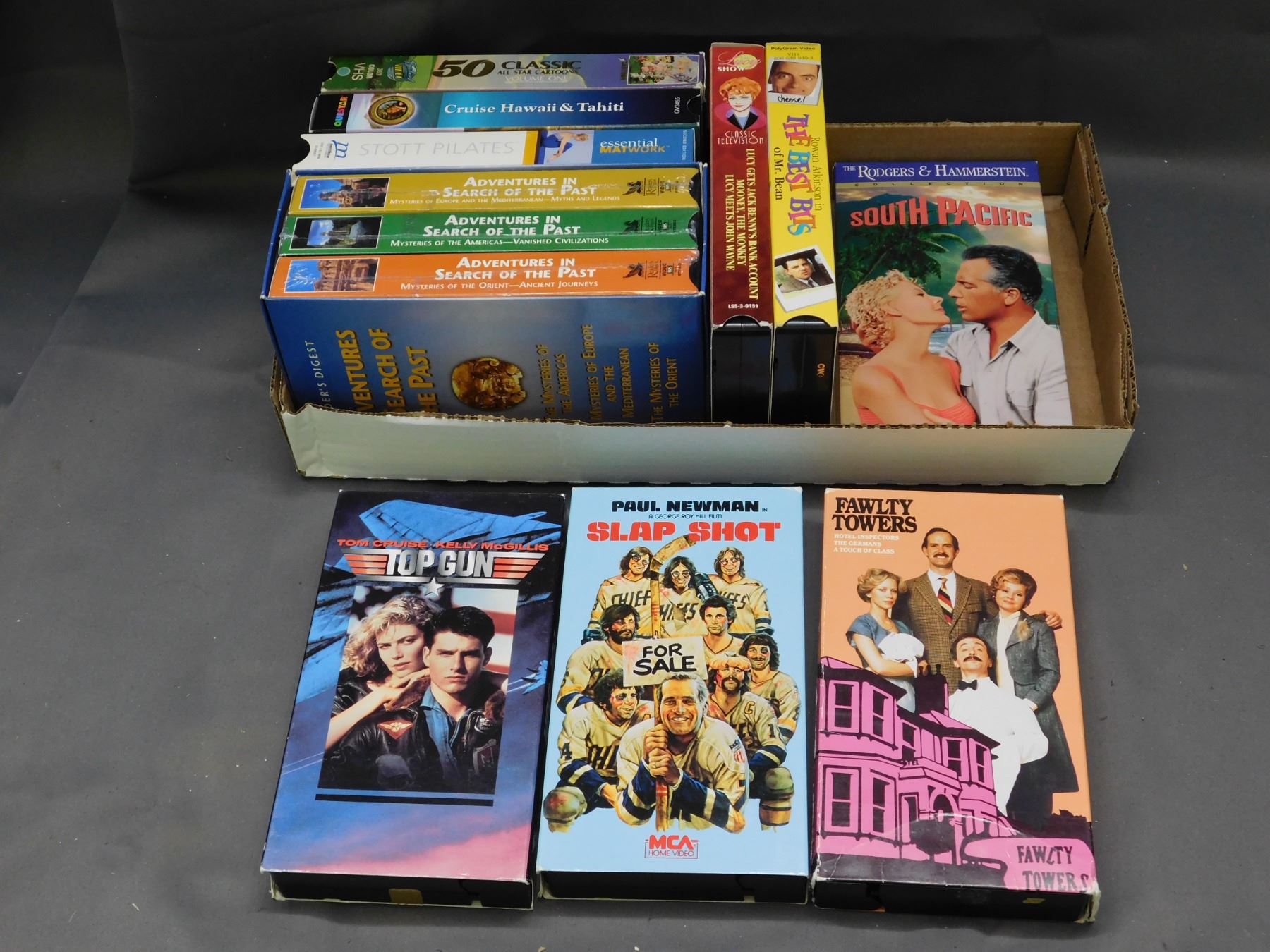 Slap Shot, Top Gun, Fawlty Towers, Mr. Bean and 8 other vintage VHS tapes