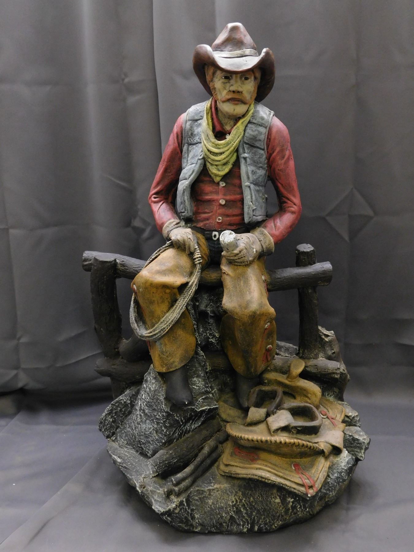Pottery Cowboy Sitting on Fence Sculpture
