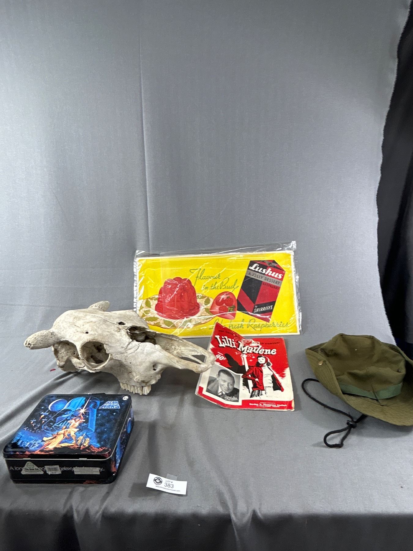 Cow Skull, Star Wars Tin Lunch Kit, & Lushus Advertising Poster Board