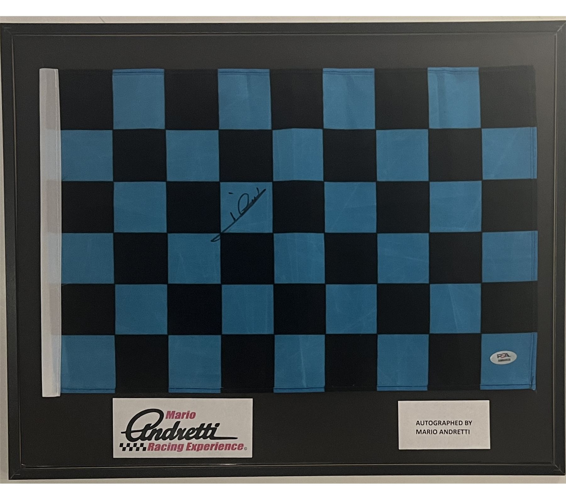 Mario Andretti signed checkered flag. PSA authenticated