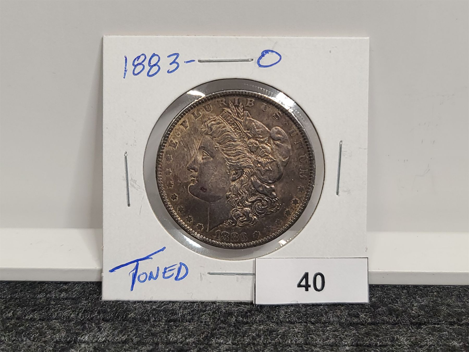 Toned 1883-O Silver Morgan Dollar - Bosley Auctioneers