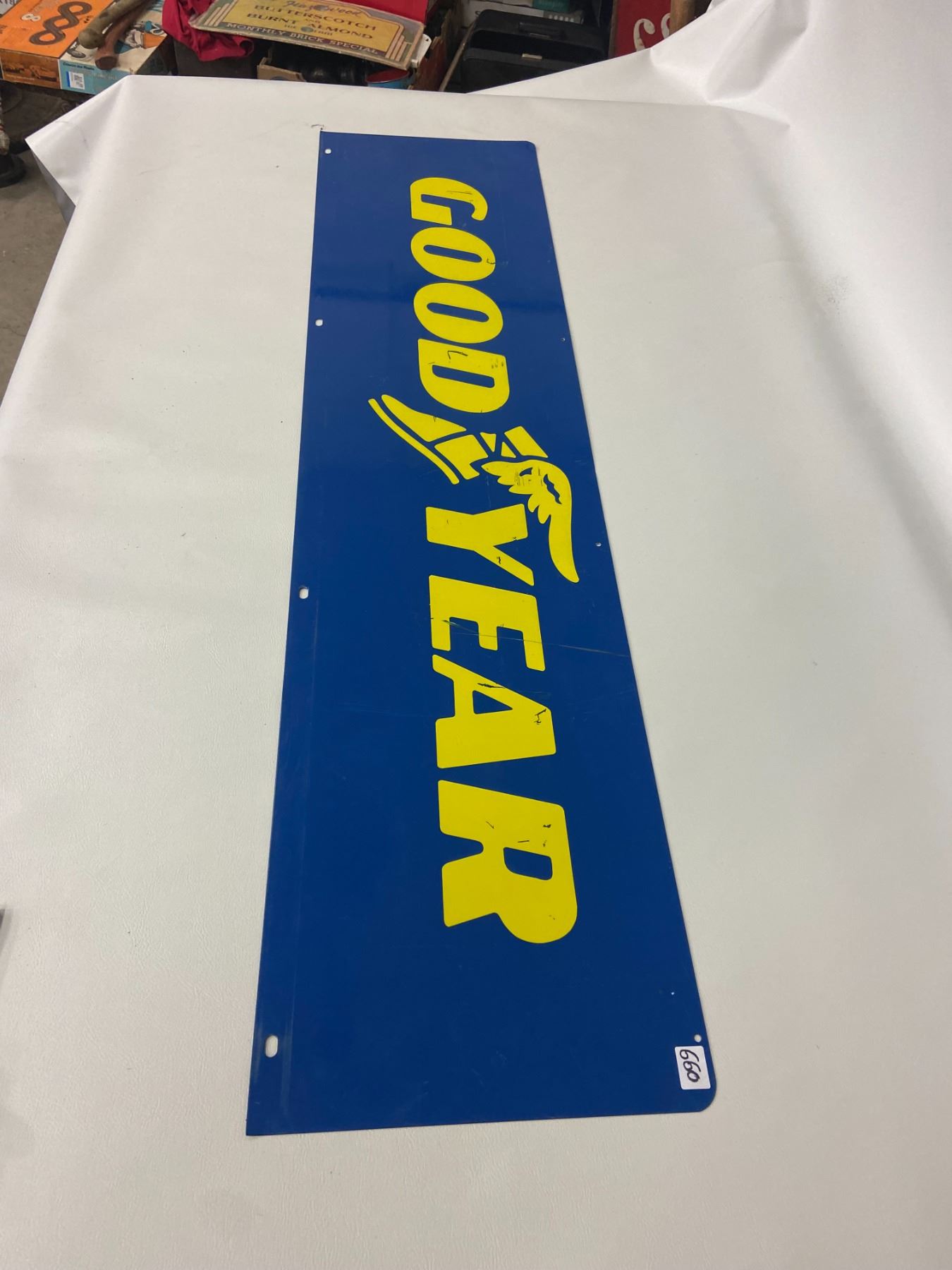 Goodyear 2 sided metal sign winged shoe 48"x12" - Schmalz Auctions