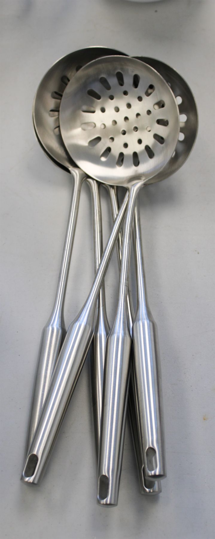 SIX STAINLESS STEEL STRAINERS