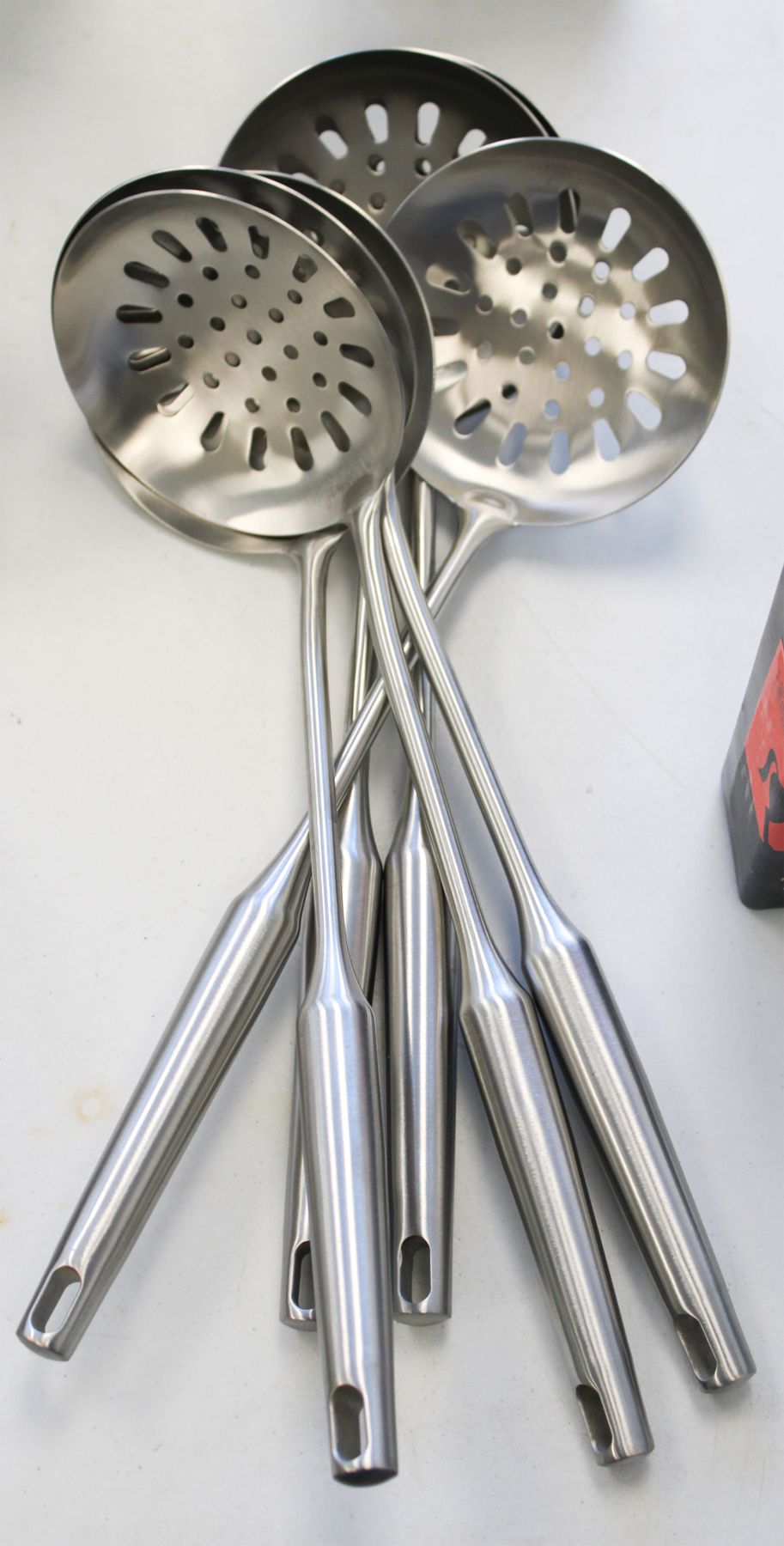 SIX STAINLESS STEEL STRAINERS