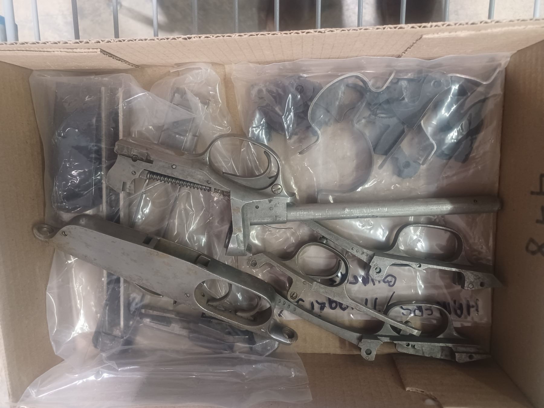 BOX OF ASSORTED GUN PARTS