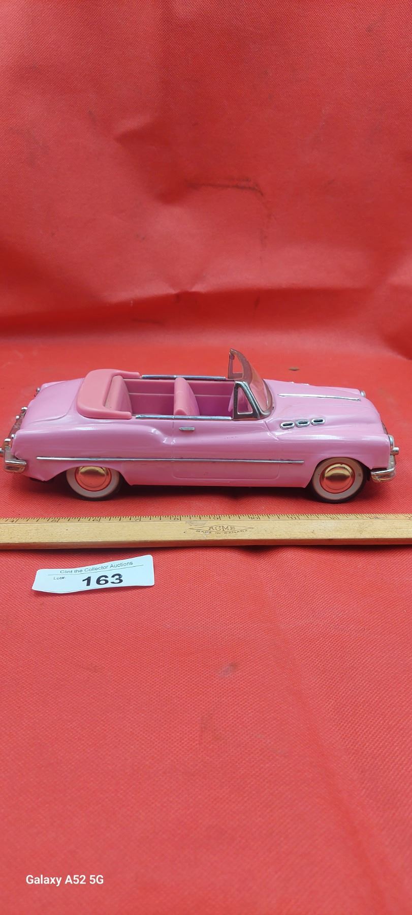 Tin toy pink Buick, 11" long