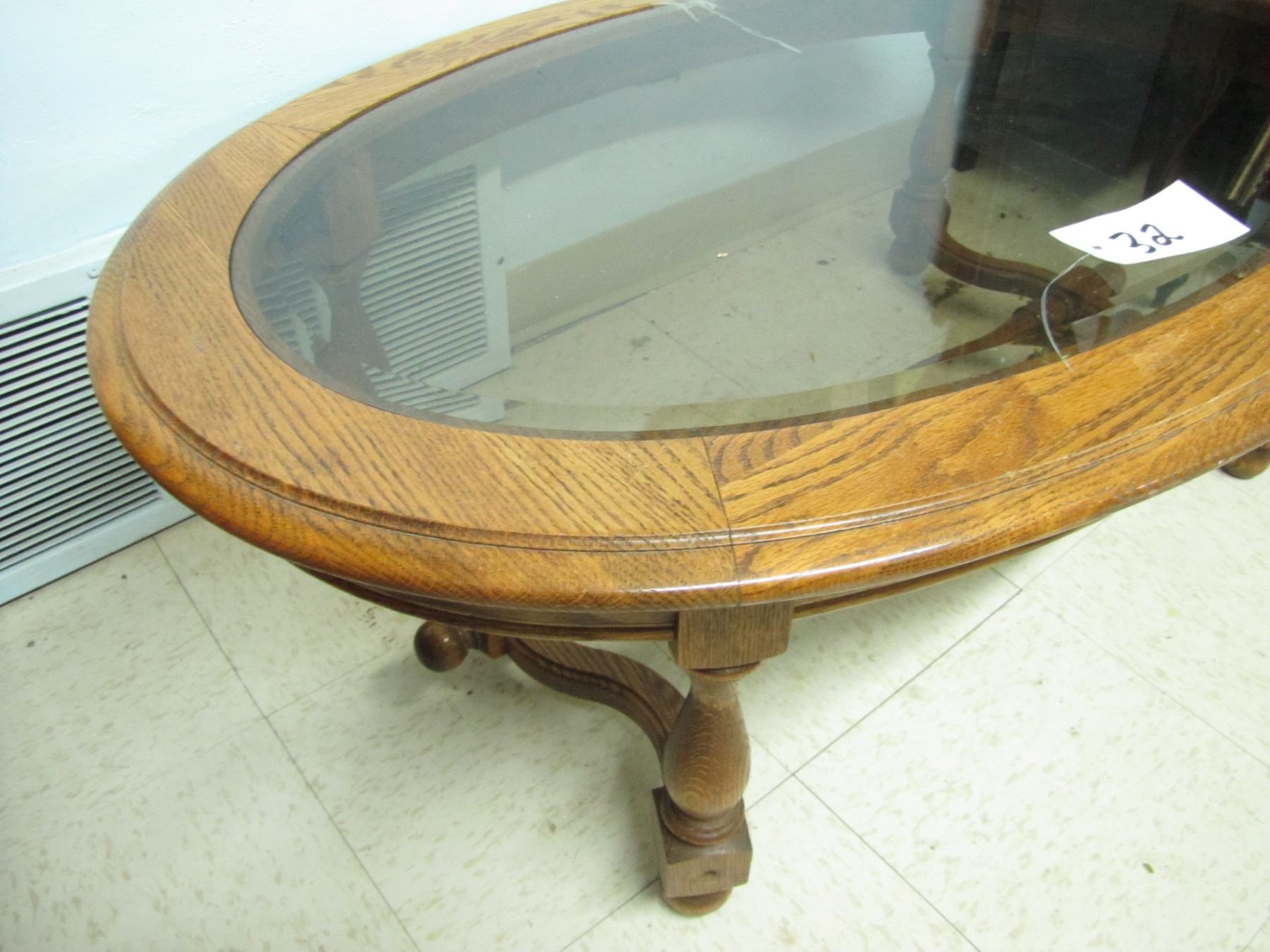 Wood framed oval coffee table with bevelled edge glass top ...