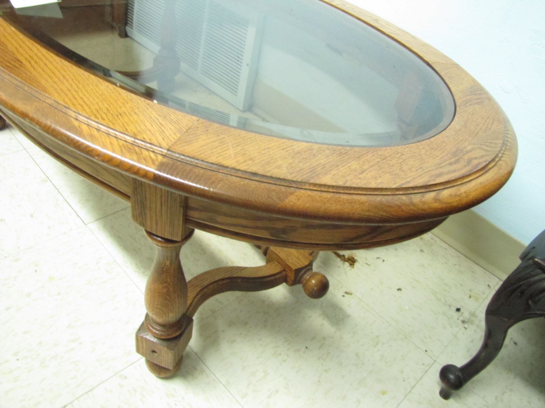Wood framed oval coffee table with bevelled edge glass top ...
