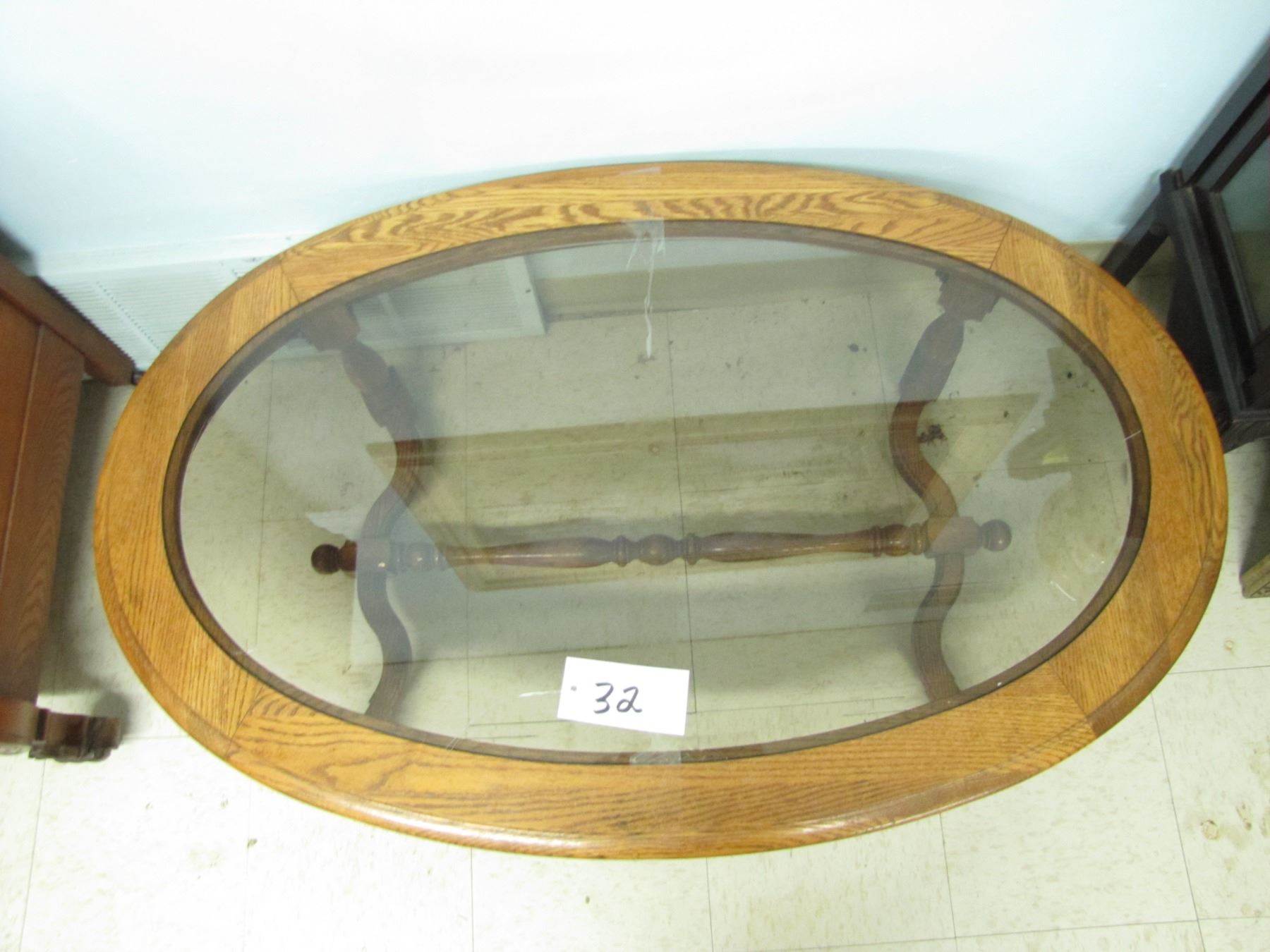 Wood framed oval coffee table with bevelled edge glass top ...