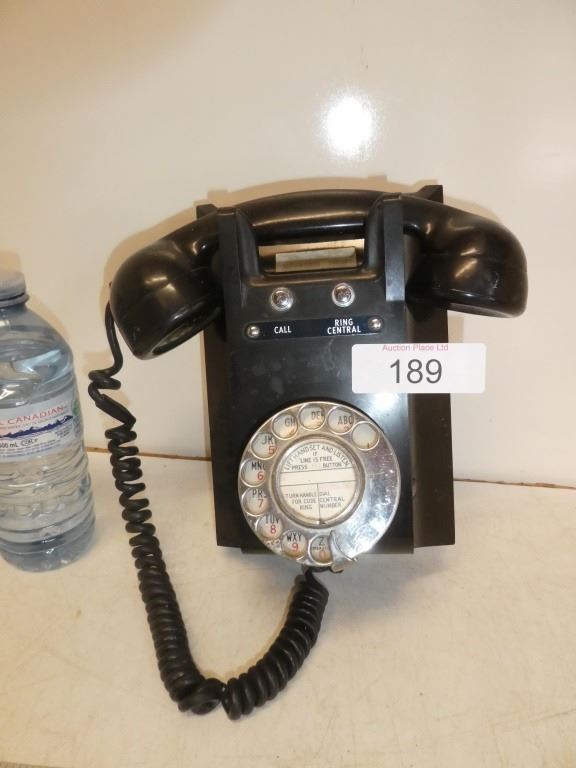 Antique rotary bakelite wall phone