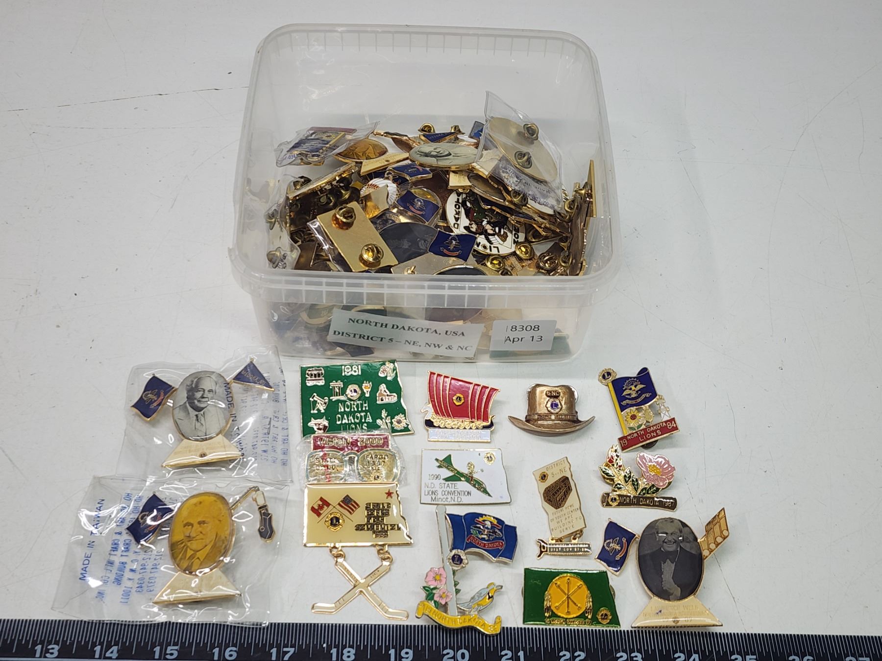 Container of Lions Club collector's pins - North Dakota - Schmalz Auctions