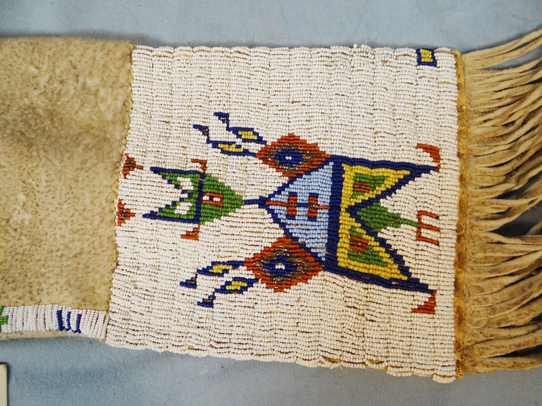 Sioux beaded pipe bag, 38" overall length, sinew sewn, beaded panels ...