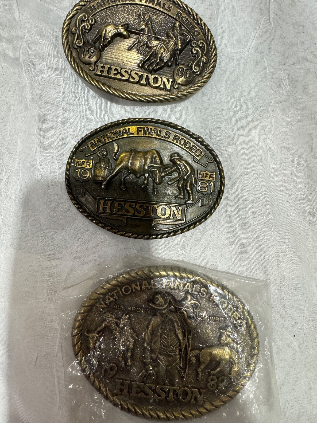 National Finals rodeo belt buckles 1-8edditiin and 1991