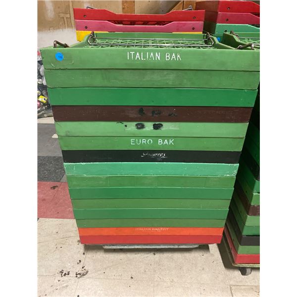 STACK OF BREAD TRAYS WITH ROLLING DOLLY