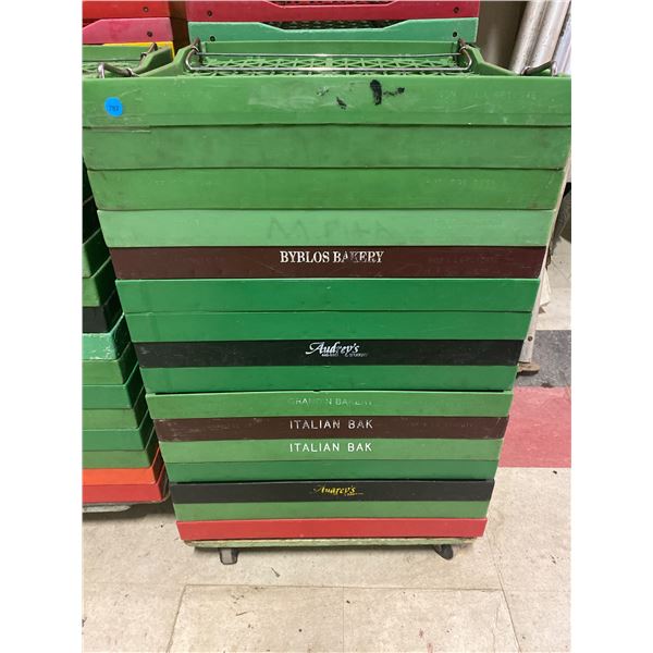 STACK OF BREAD TRAYS WITH ROLLING DOLLY
