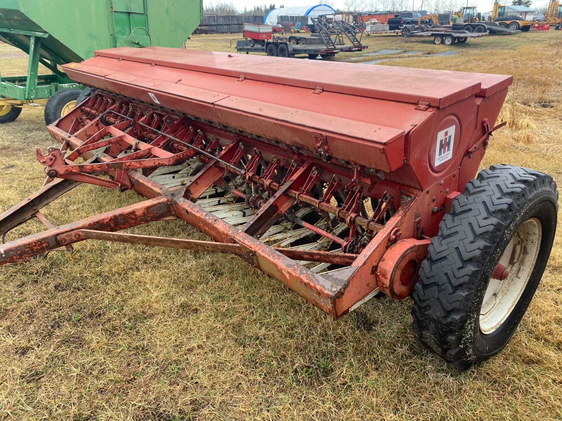 IH 12 ft rub. End wheel seed drill c/w grass & fertilizer
