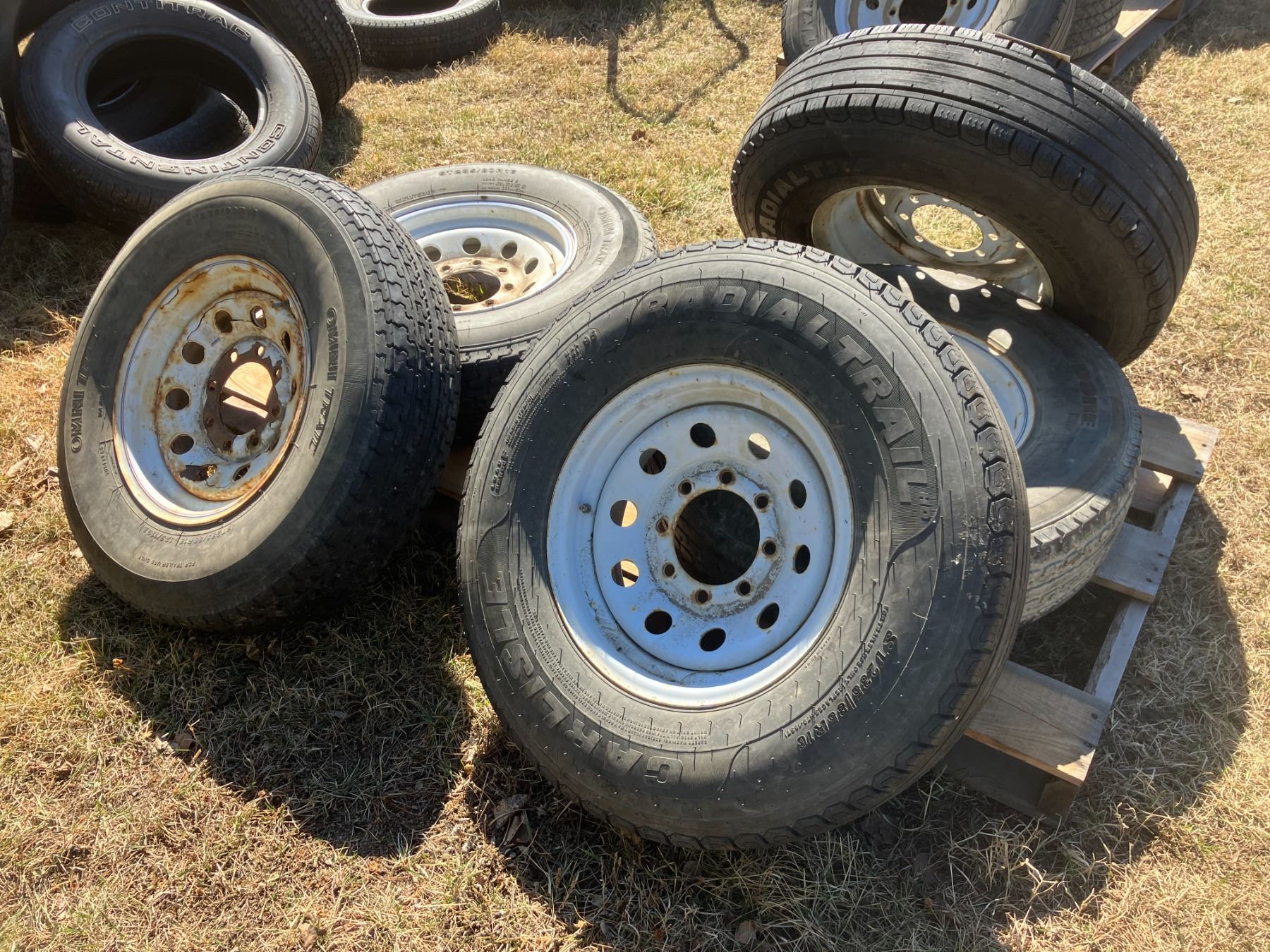 (Selling all together) 5- 16" tires. 8 hole trailer rims. Sells together.