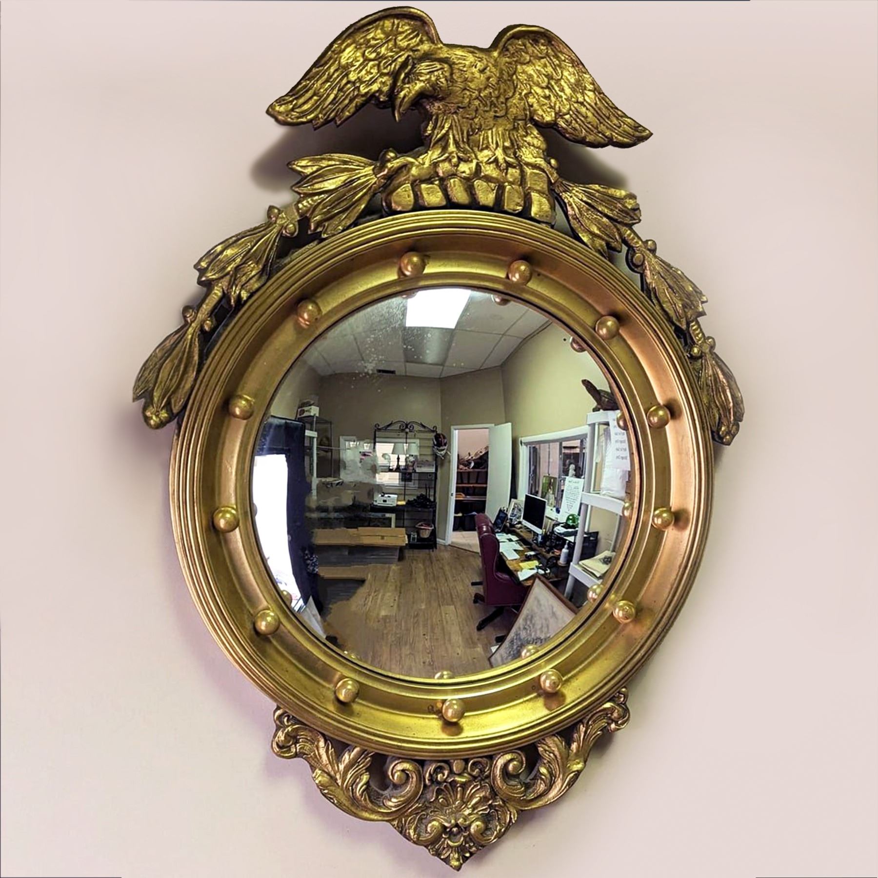 A Gilt Painted Federal Style Bulls Eye Mirror With Eagle Crest