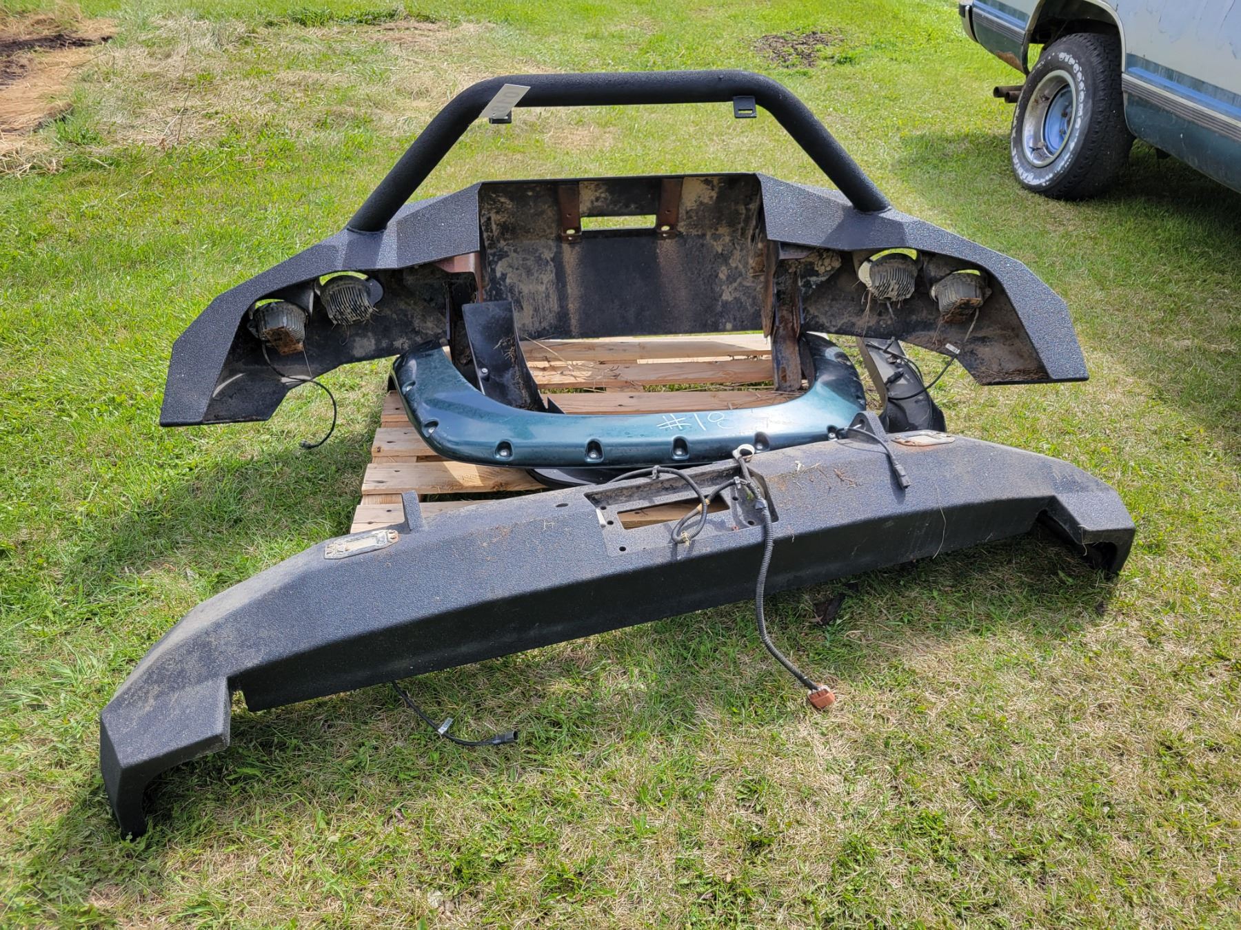 2- Custom made bumpers & 2- wheel wells (came off a Ford) (West Yard)