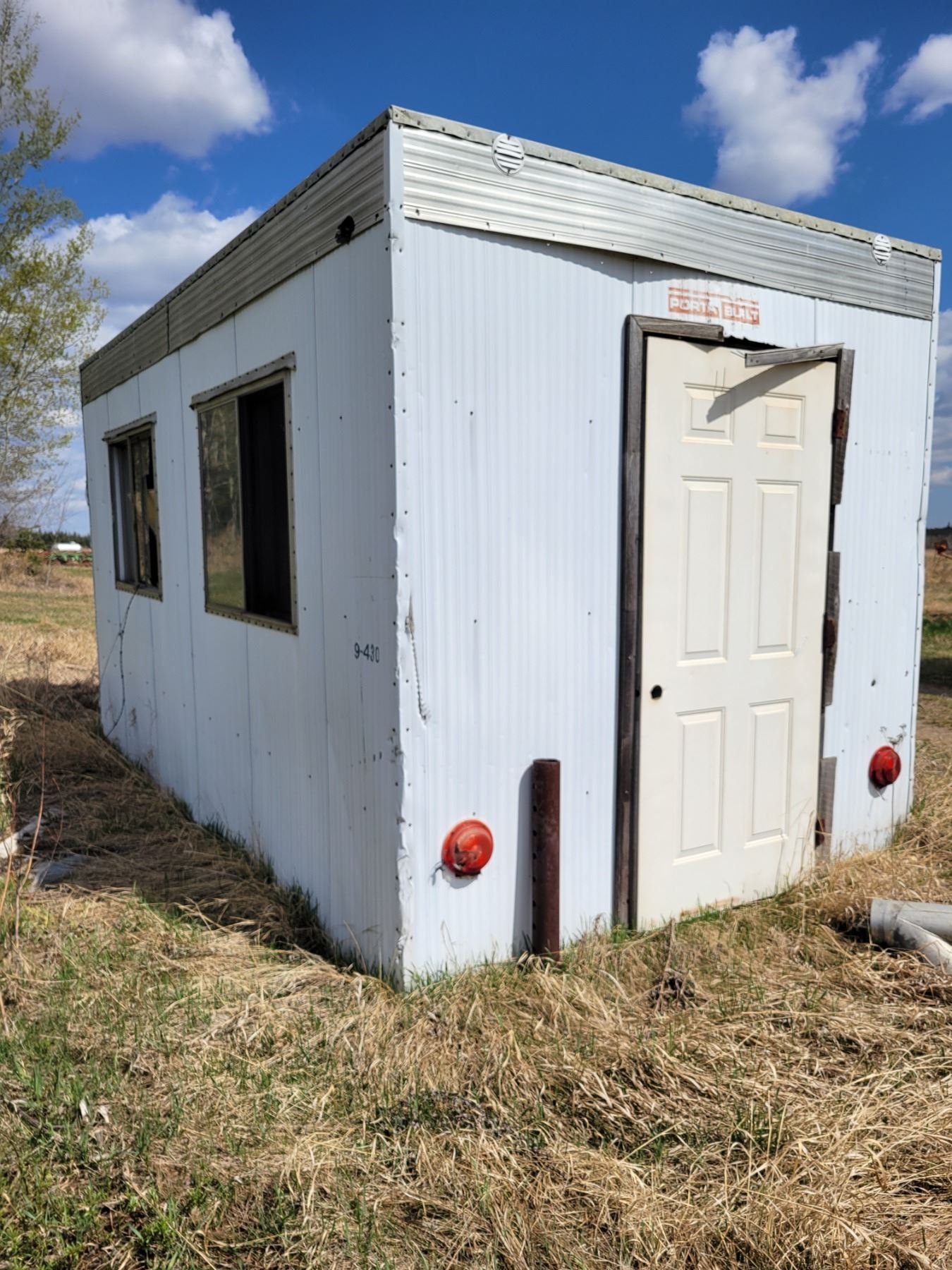 Skid shack (needs repair) c/w contents